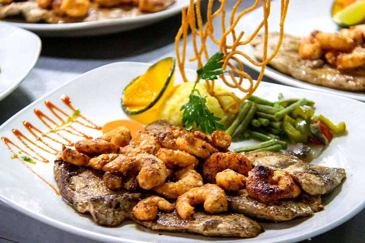 1910 Restaurante & Bar - Grilled fish fillet with shrimp in a red sauce ...